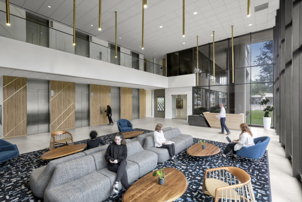 Memorial Tower II _ Main lobby reception with people - Abel Design Group
